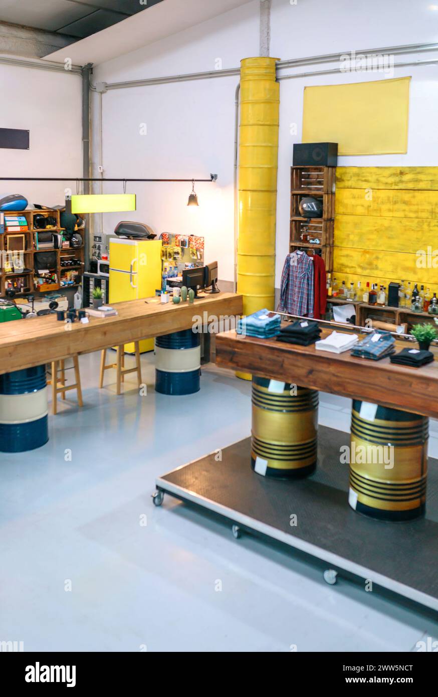 Interior of empty clothing store with clothes on counter over fuel ...