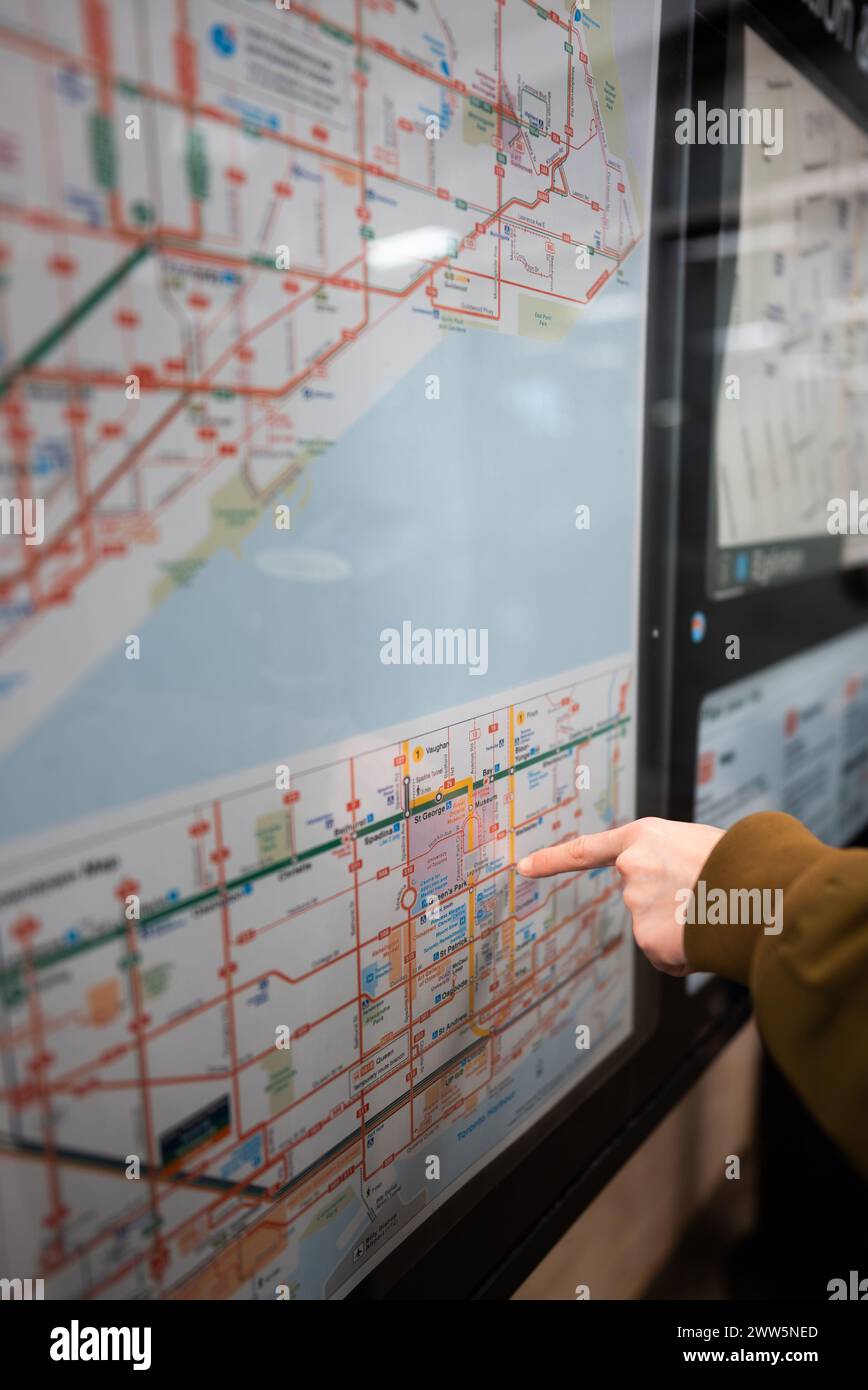 person at subway station looking at transport city map, tourist ...
