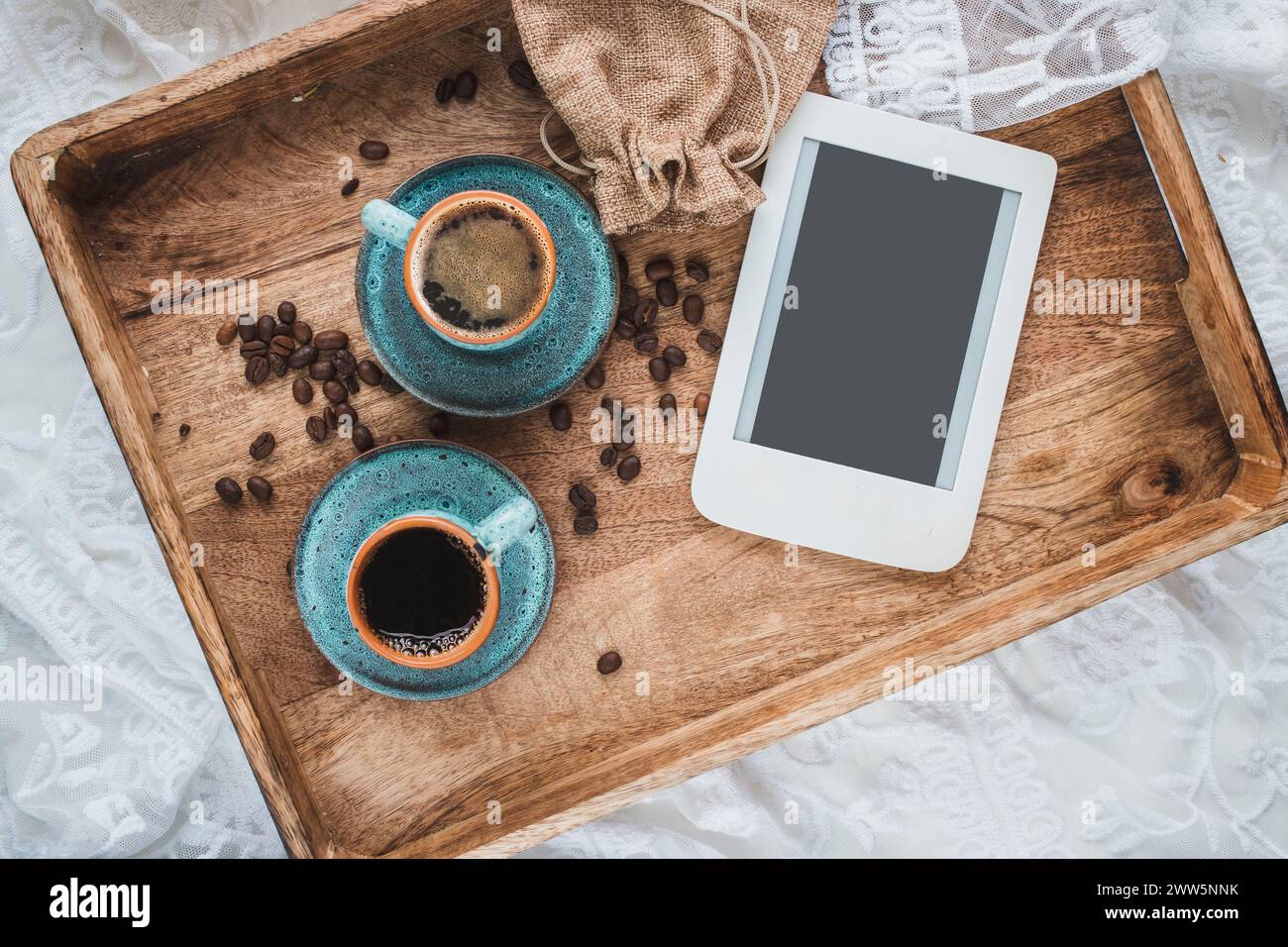 Composition with two cups of espresso, roasted coffee beans and e ...