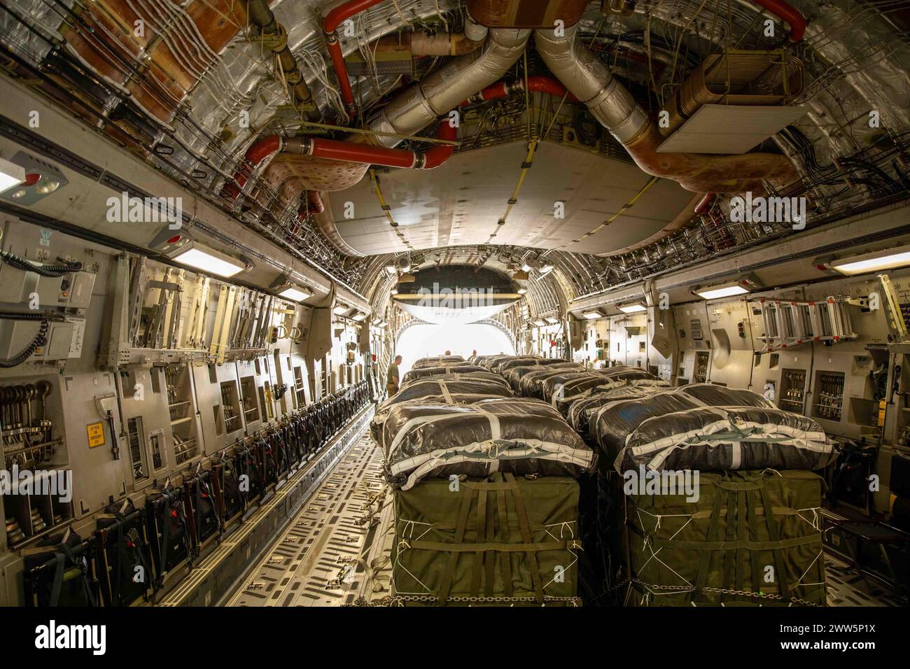 Humanitarian aid pallets rigged with parachutes destined for an airdrop ...