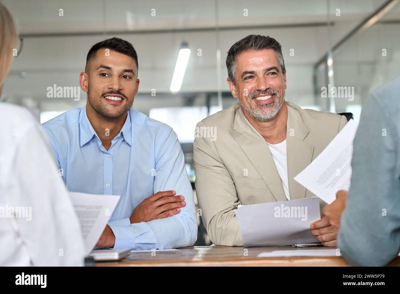 Happy busy professional business people at group meeting working ...