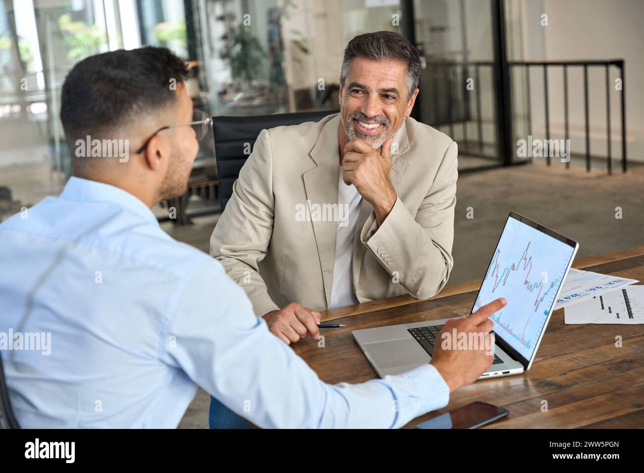 Professional investor pointing financial data hi-res stock photography ...