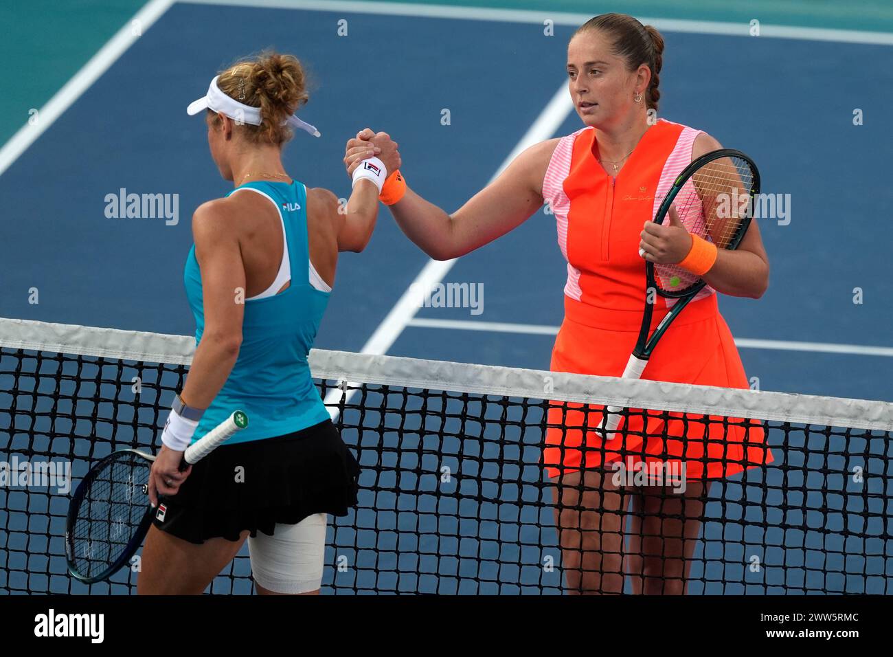 Jelena Ostapenko, of Latvia, right, shakes hands with Laura Siegemund ...