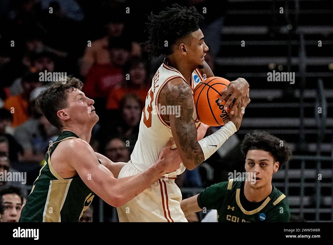 Texas forward Dillon Mitchell (23) steals the ball from Colorado State ...