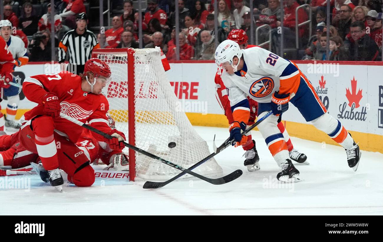 Detroit Red Wings defenseman Simon Edvinsson (77) stops a New York ...