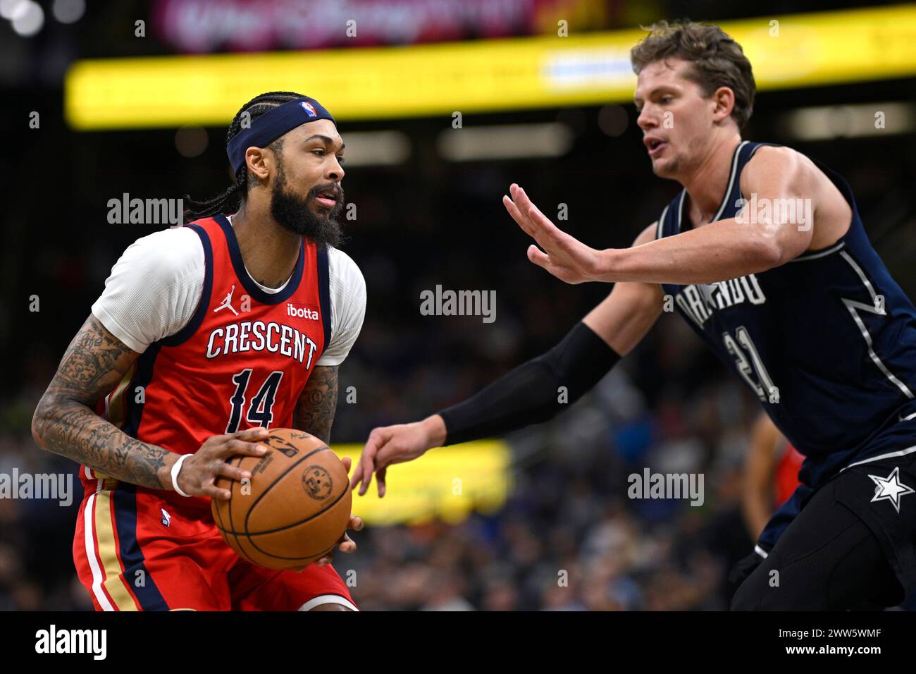 New Orleans Pelicans forward Brandon Ingram (14) is defended by Orlando ...