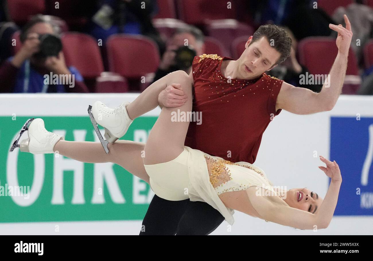 Lia Pereira, bottom, and Trennt Michaud of Canada perform their free ...