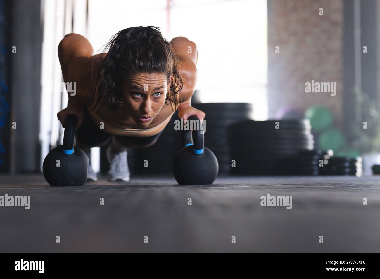 Woman performing strength training exercises hi-res stock photography ...
