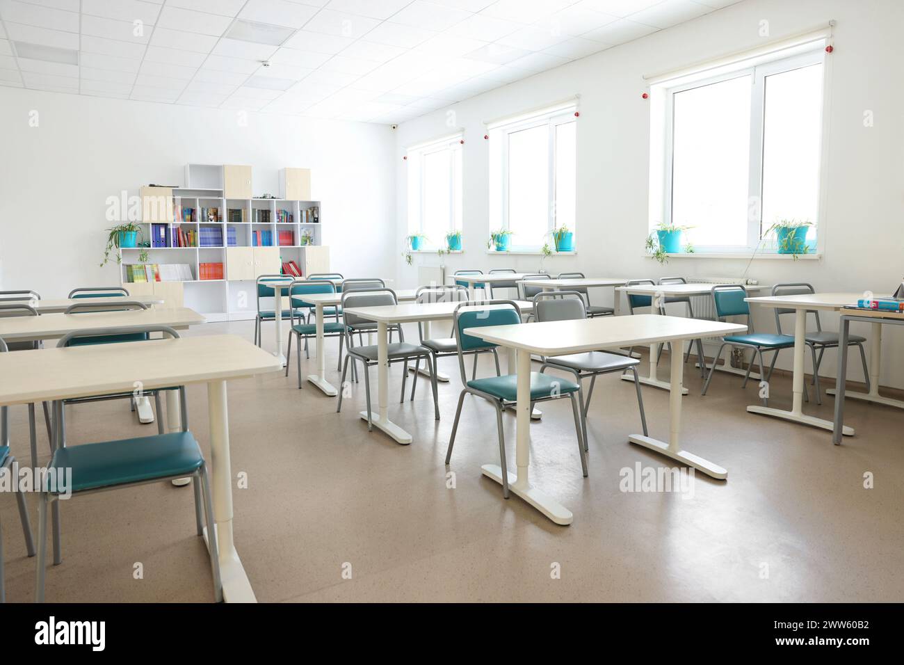 Empty school classroom with desks, windows and chairs Stock Photo - Alamy
