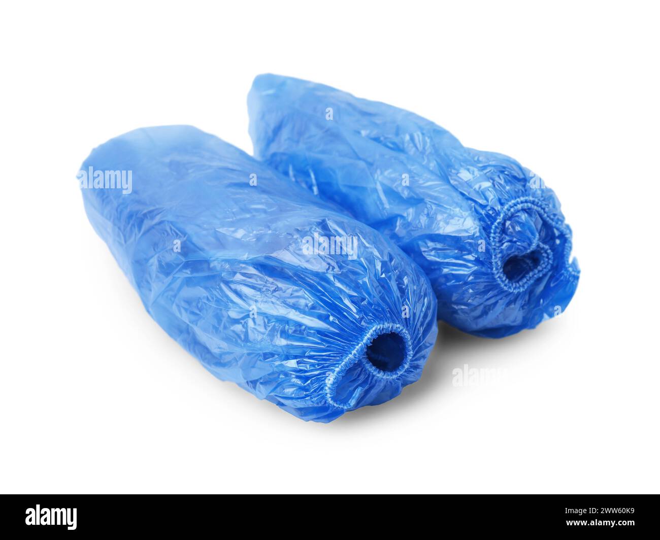 Rolled blue shoe covers isolated on white Stock Photo - Alamy