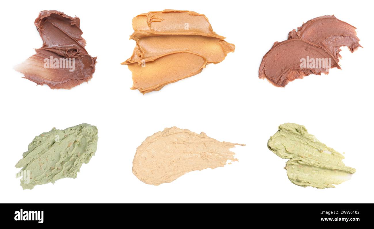 Different tasty nut butters isolated on white, top view Stock Photo - Alamy