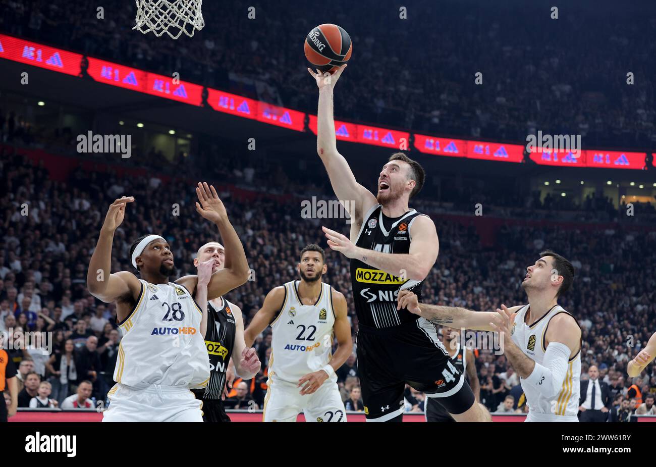 Belgrade, Serbia. 21st Mar, 2024. Partizan's Frank Kaminsky (top) vies ...