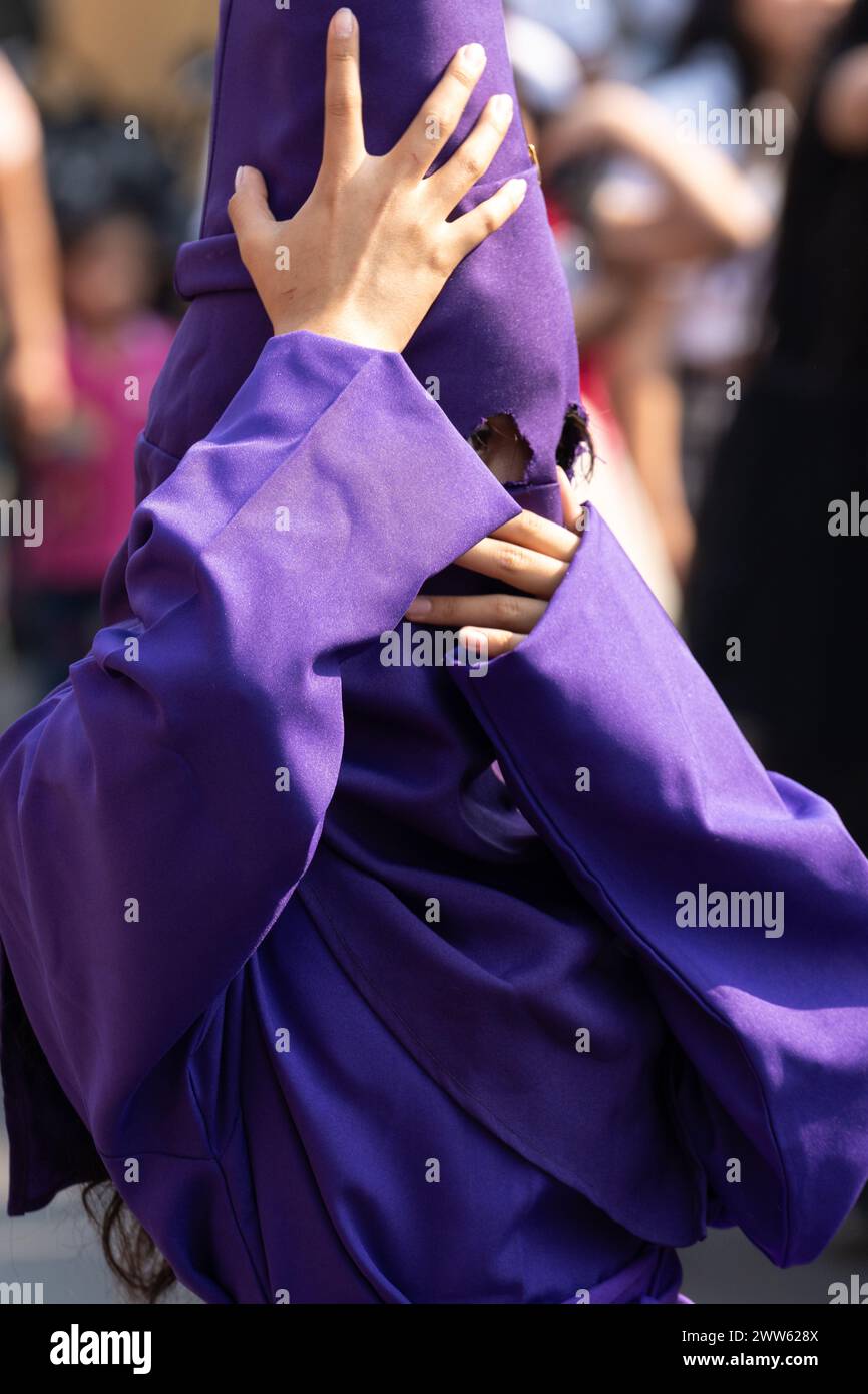 Antigua, Guatemala. 21st Mar, 2024. A young Guatemalan child, dressed in the cone hat of a ...