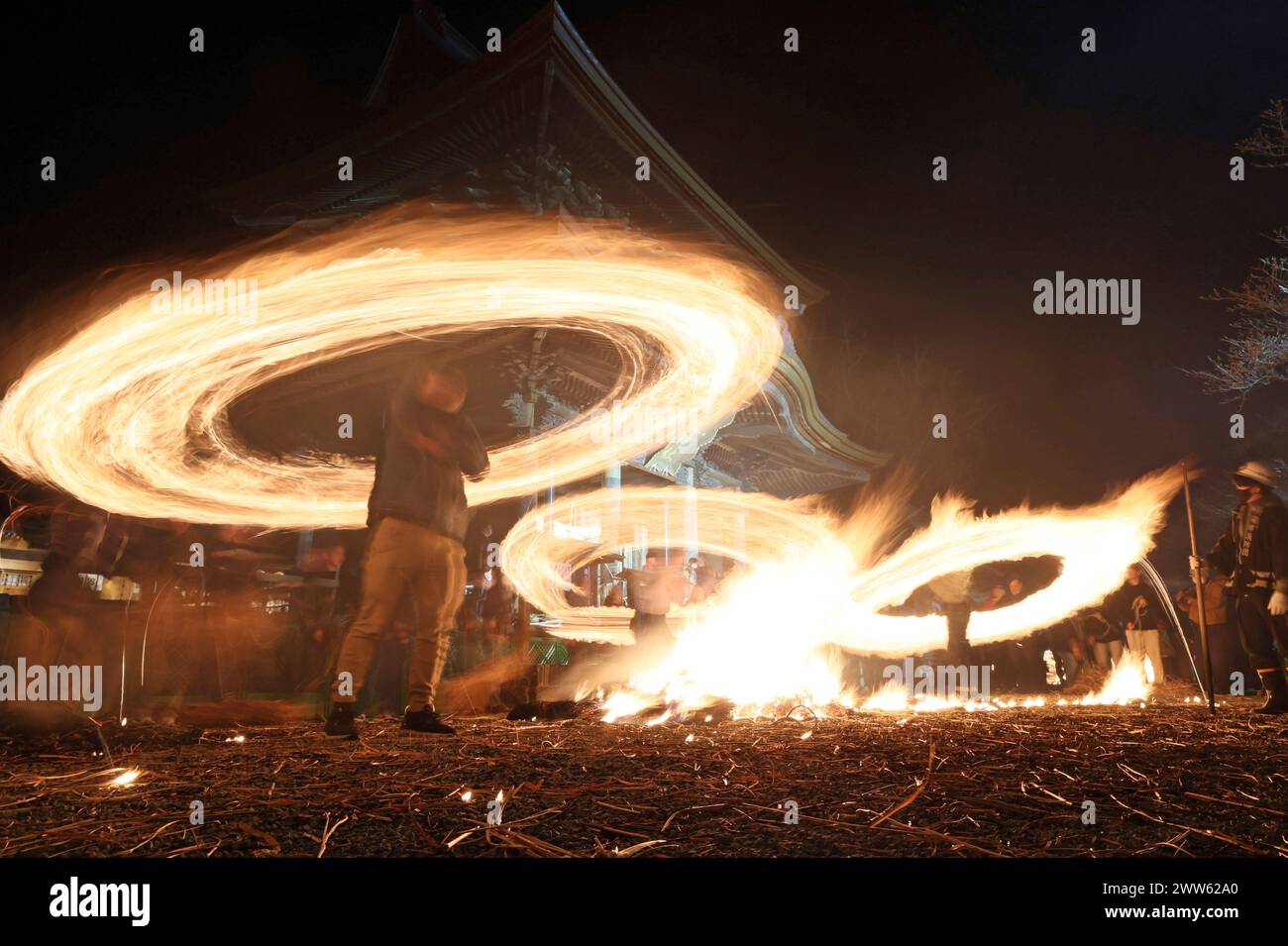 A long exposure photo shows Hiburi (swinging fire) Shinji (ritual ...