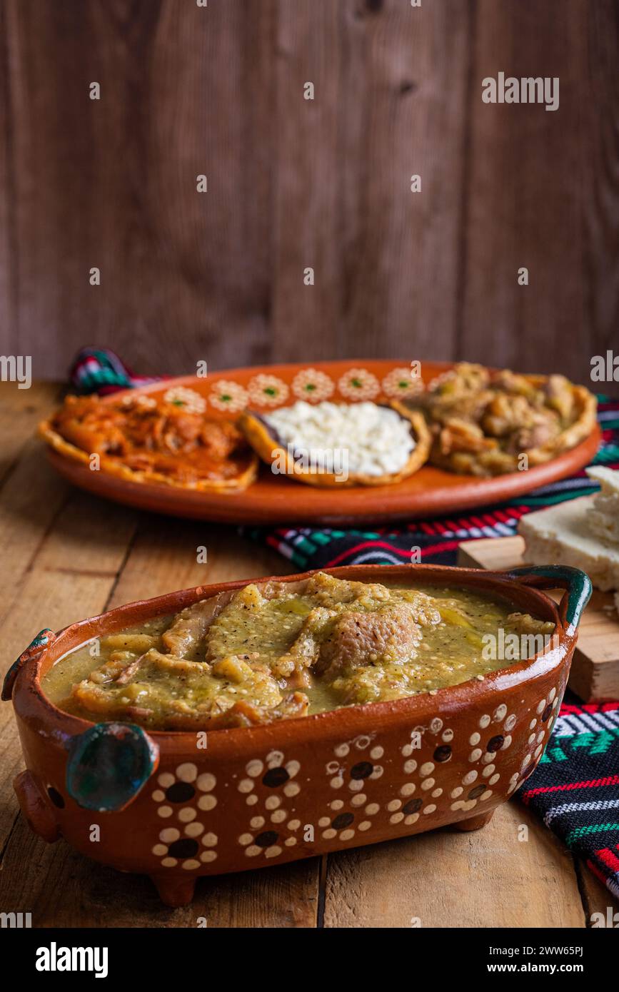 Chicharrones in green sauce, typical mexican food. Mexican food in clay ...