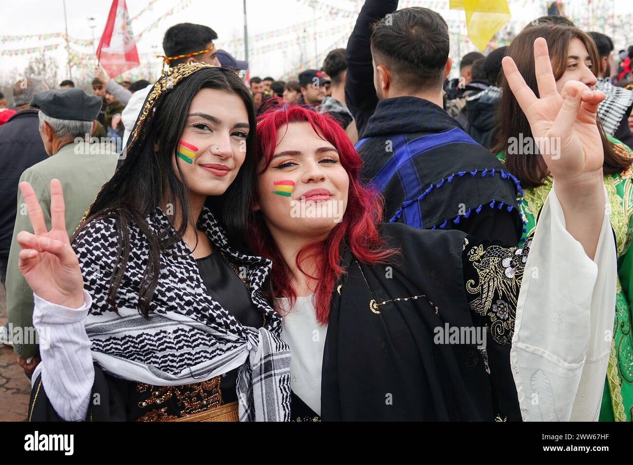 Two Kurdish women who painted their faces with the Kurdish national ...