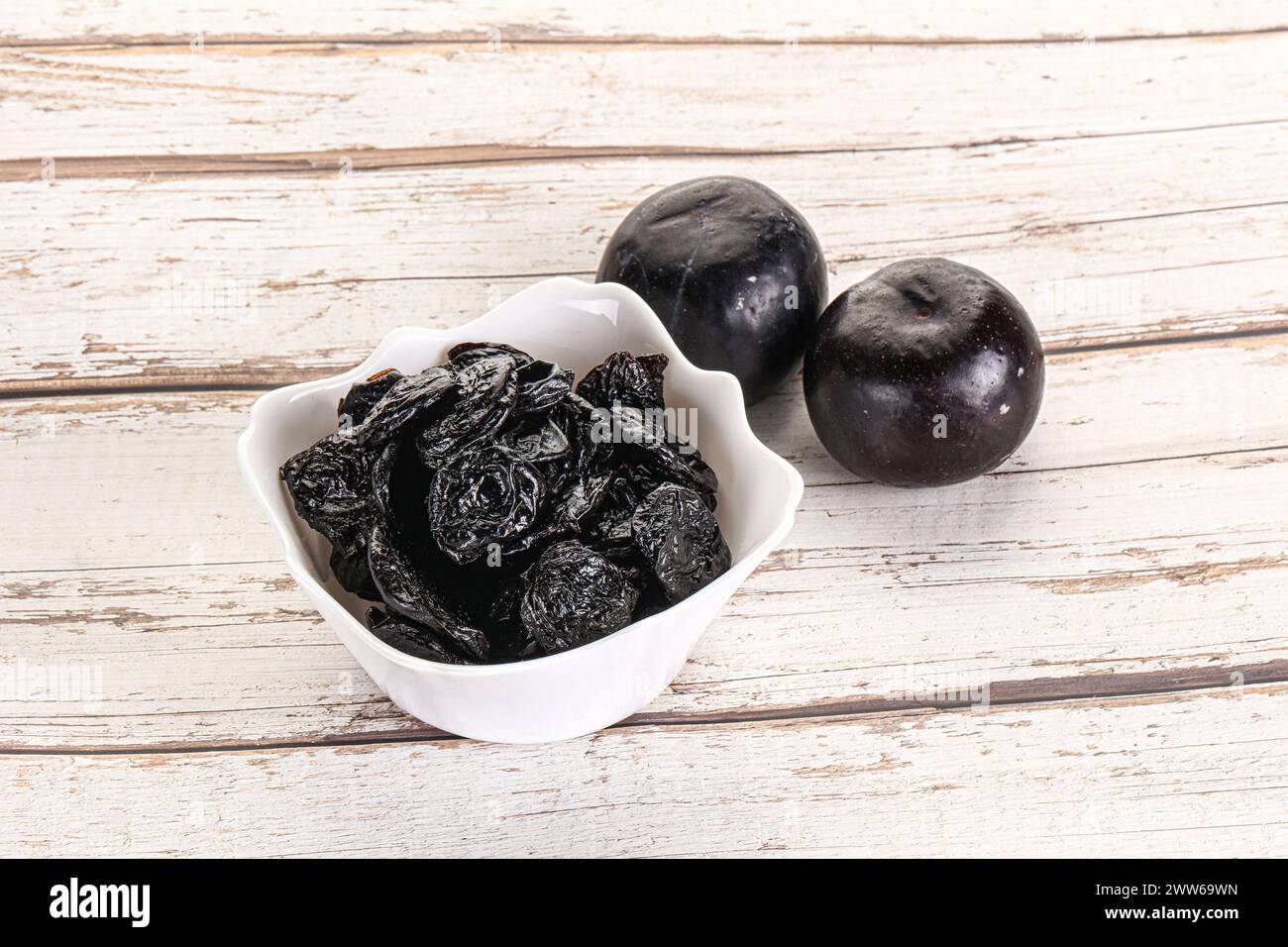 Dry sweet prunes in thw bowl Stock Photo - Alamy
