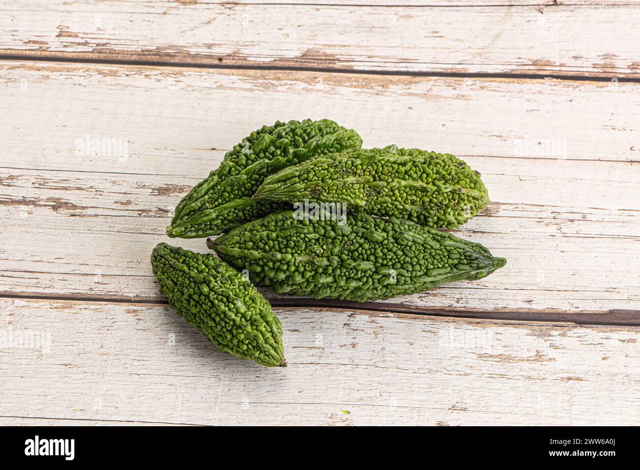 Green raw bitter lemon vegetables heap Stock Photo - Alamy