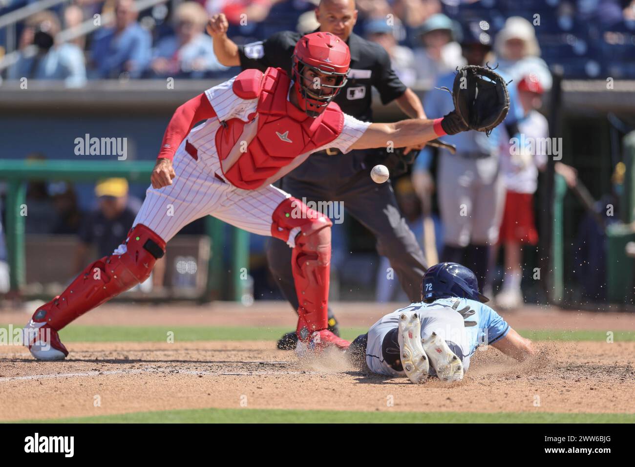 Clearwater, FL: Tampa Bay Rays left fielder Jake Mangum (72) is safe sliding under the tag of ...
