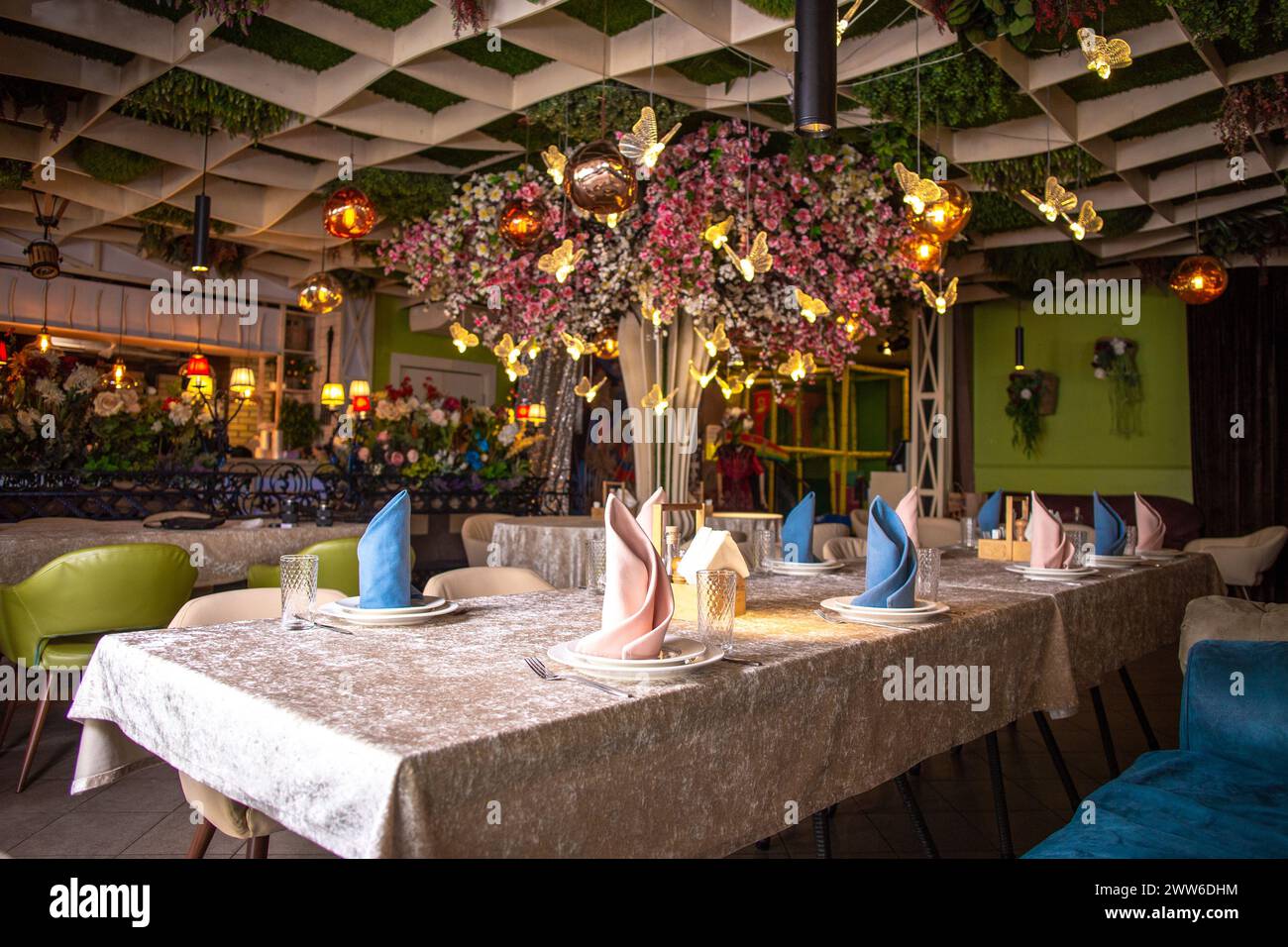 The image shows a beautifully decorated restaurant interior with a ...