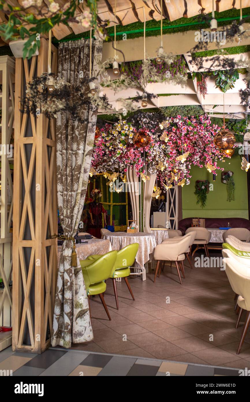 The image shows a beautifully decorated restaurant interior with a ...