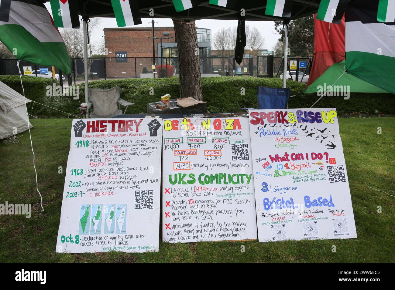 Protesters set up information boards and a table of leaflets directly ...