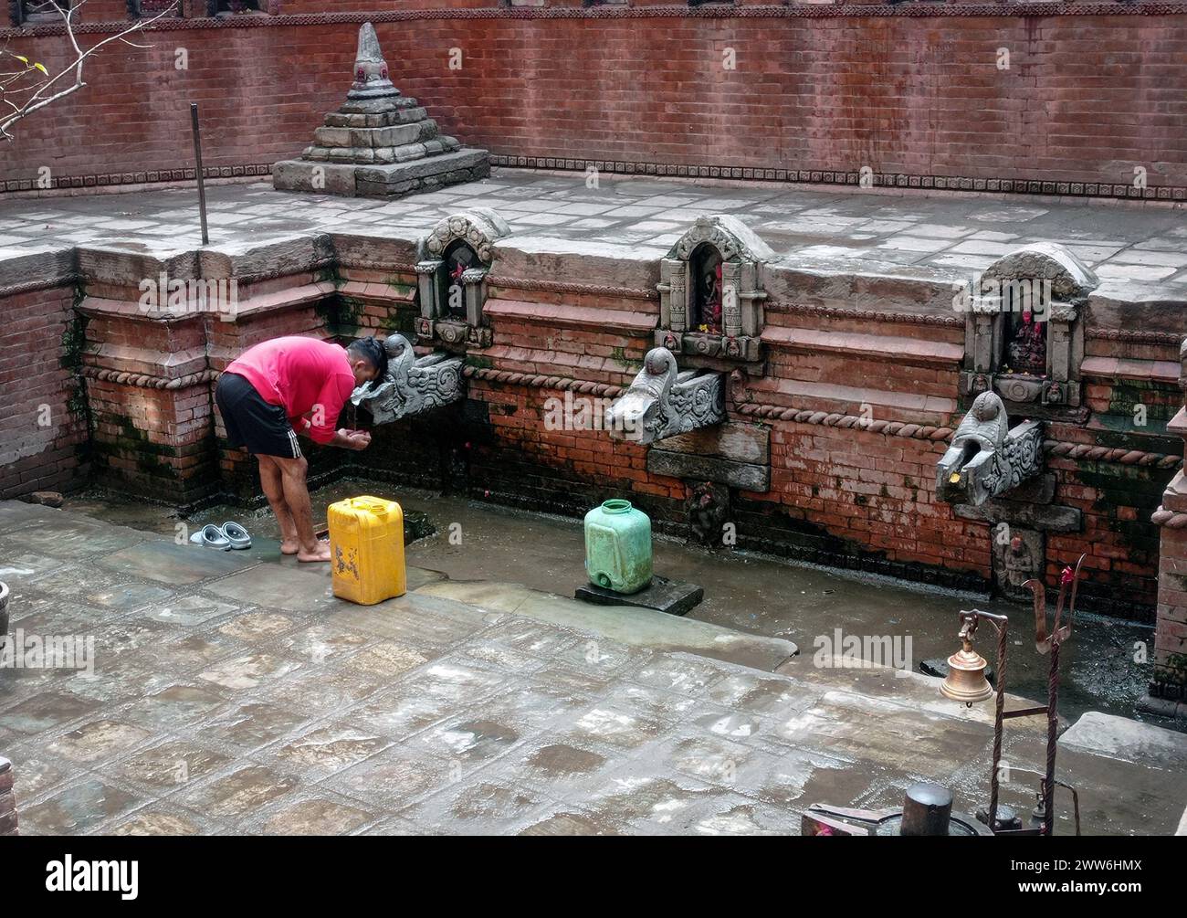 Kathmandu, Bagmati, Nepal. 22nd Mar, 2024. A Nepali man fills water ...