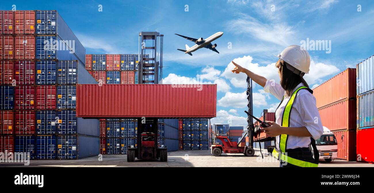 Foreman Woman control loading Containers box from Cargo freight ship ...