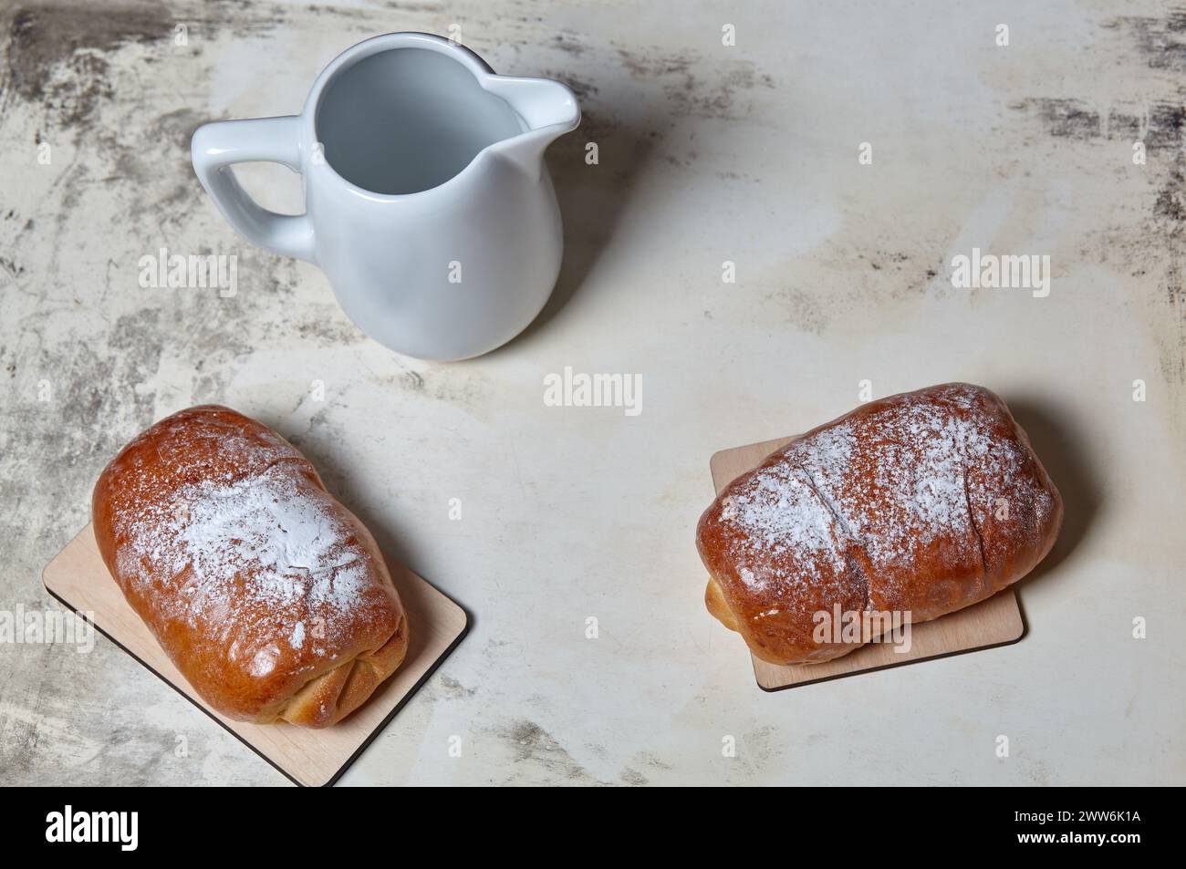 Homemade buns with jam with powdered sugar on wooden background. Fresh ...
