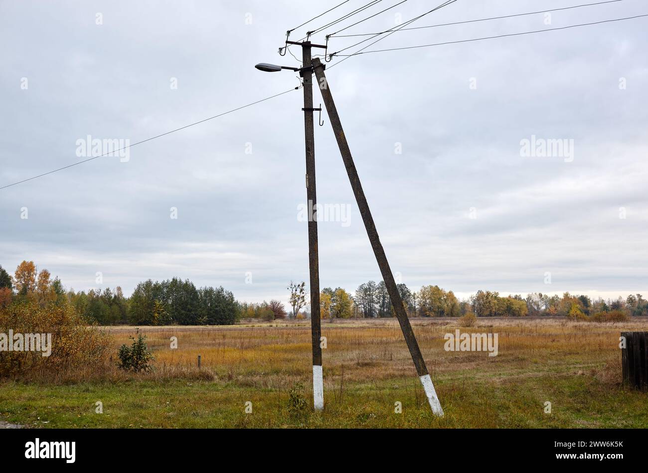 Closeup of power pillar at rural terrain. Power line post with ...