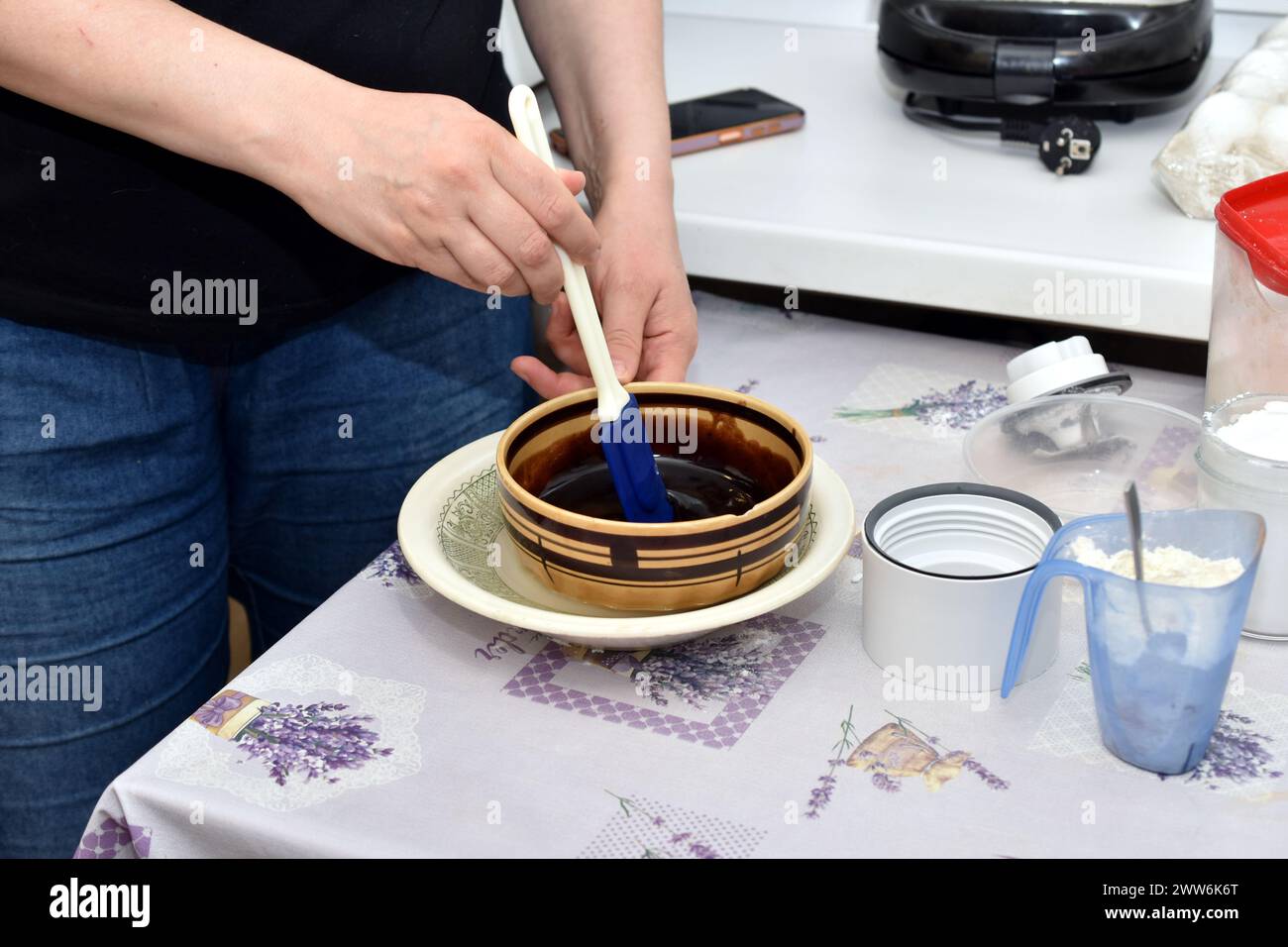 Woman stirs cream in white hi-res stock photography and images - Alamy