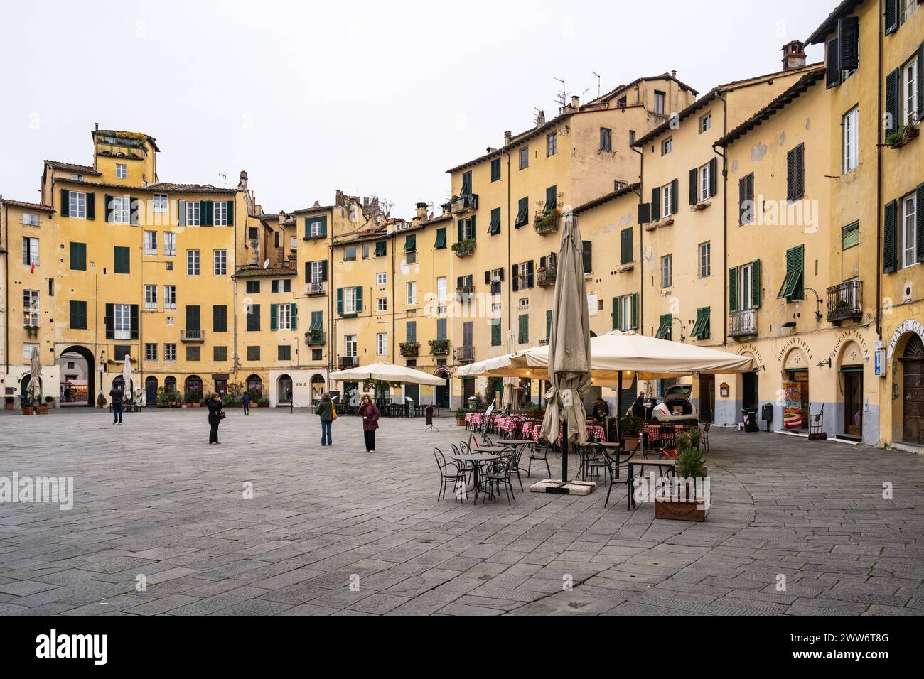 Piazza dell Anfiteatro the heart of the city of Lucca, Italy Stock ...