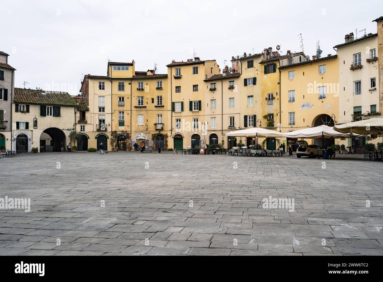 Piazza dell Anfiteatro the heart of the city of Lucca, Italy Stock ...