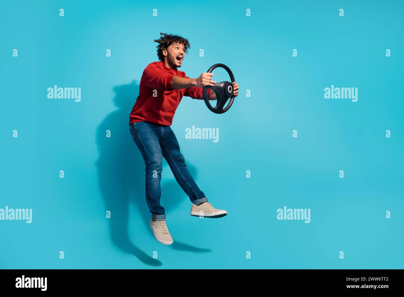 Full body length photo of overjoyed curly hair hispanic guy driving his ...