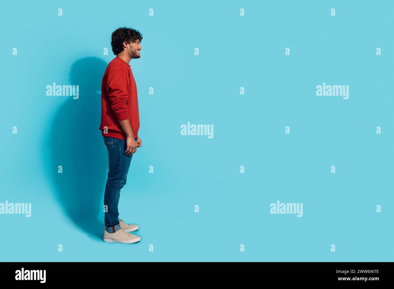 Full size profile photo of cheerful young man stand look empty space ...