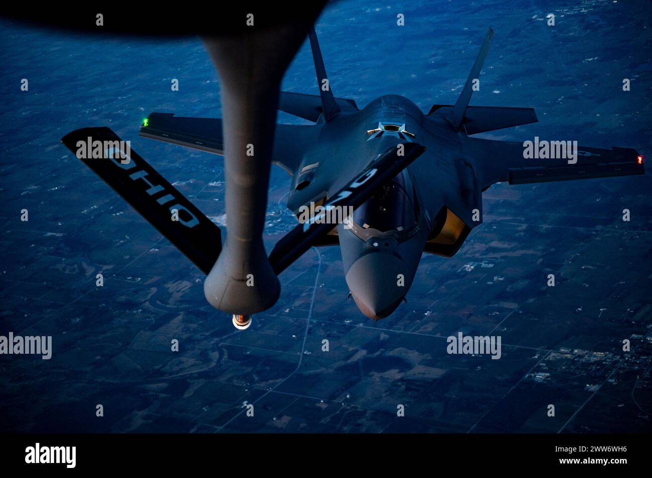 An F-35 Lightning II with the 115th Fighter Wing approaches a KC-135 ...