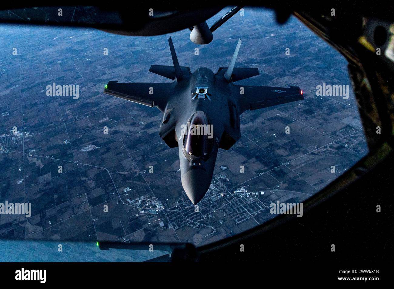 An F-35 Lightning II with the 115th Fighter Wing approaches a KC-135 ...