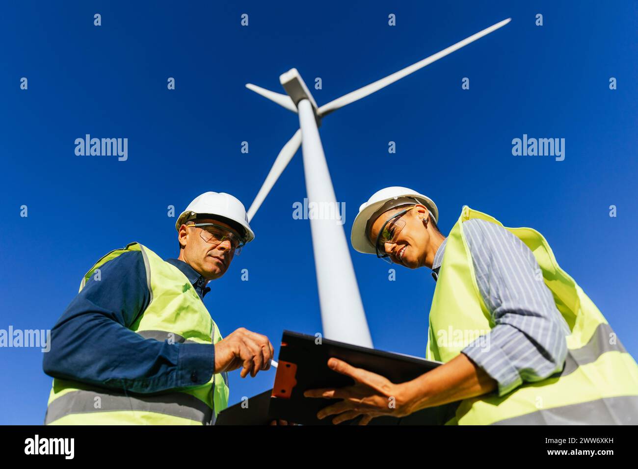 Electrical engineer working on reports on a wind energy farm Stock ...