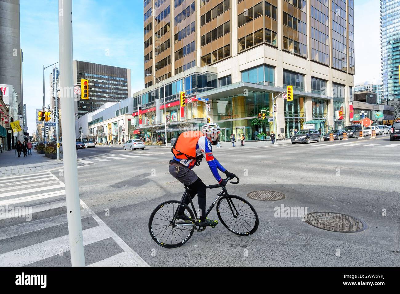 Male cyclist in downtown district, Toronto, Canada Stock Photo - Alamy
