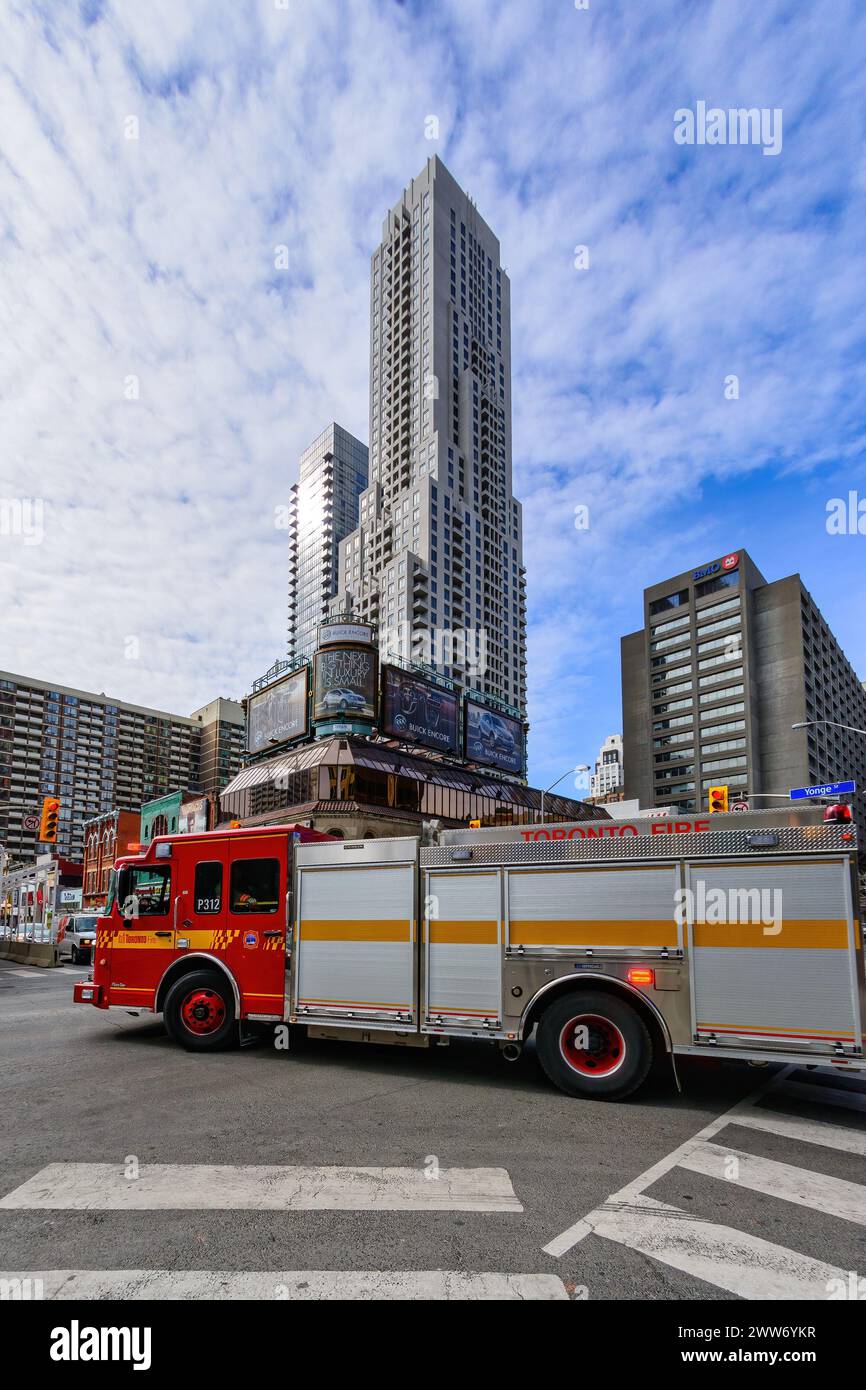 Fire truck of the Toronto Fire Department driving in the downtown ...