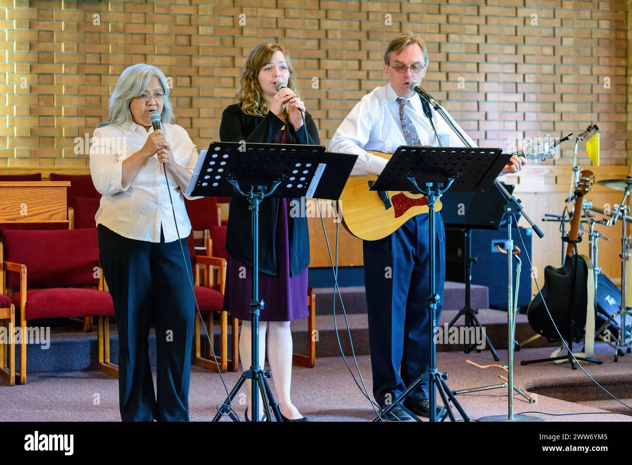 Three people praising God in protestant church, Toronto, Canada Stock ...