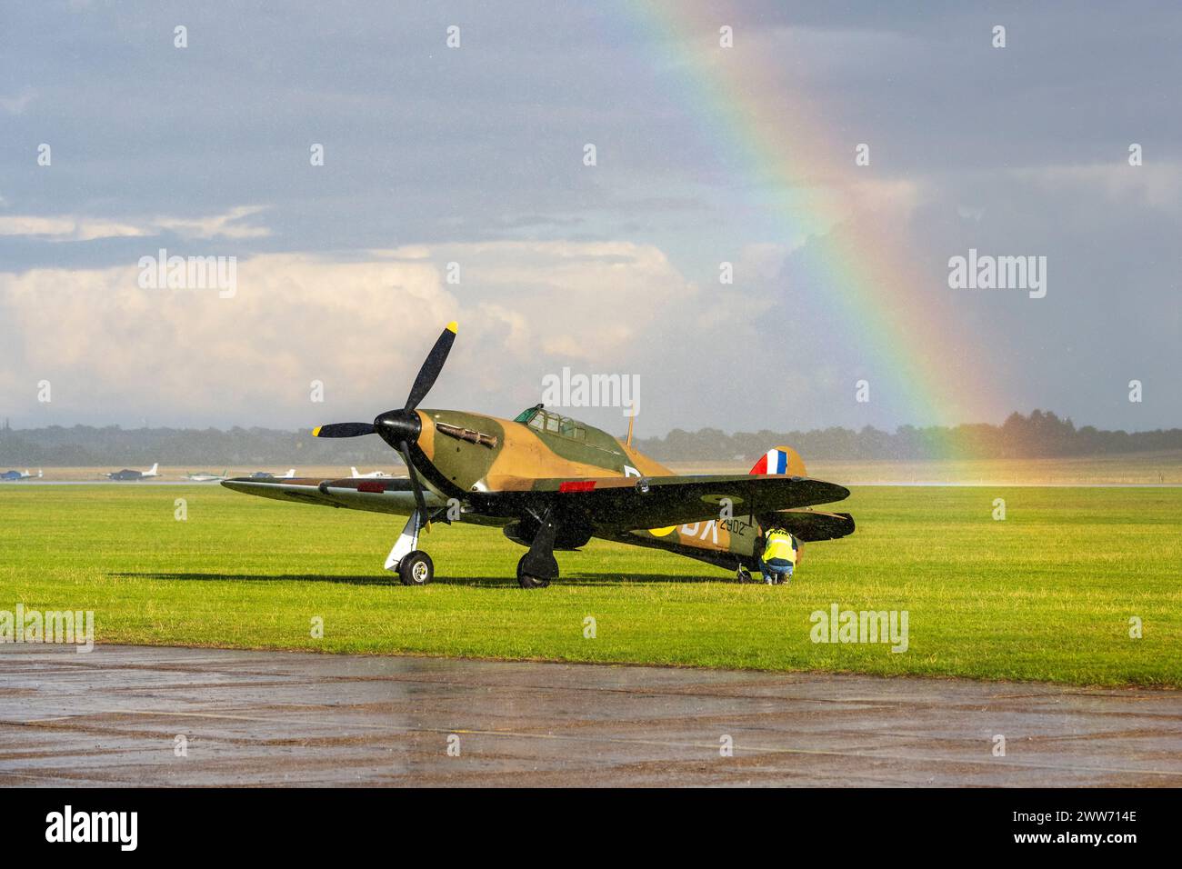 Hawker Hurricane Mk1 P2902 in downpour with rainbow overhead at Duxford ...