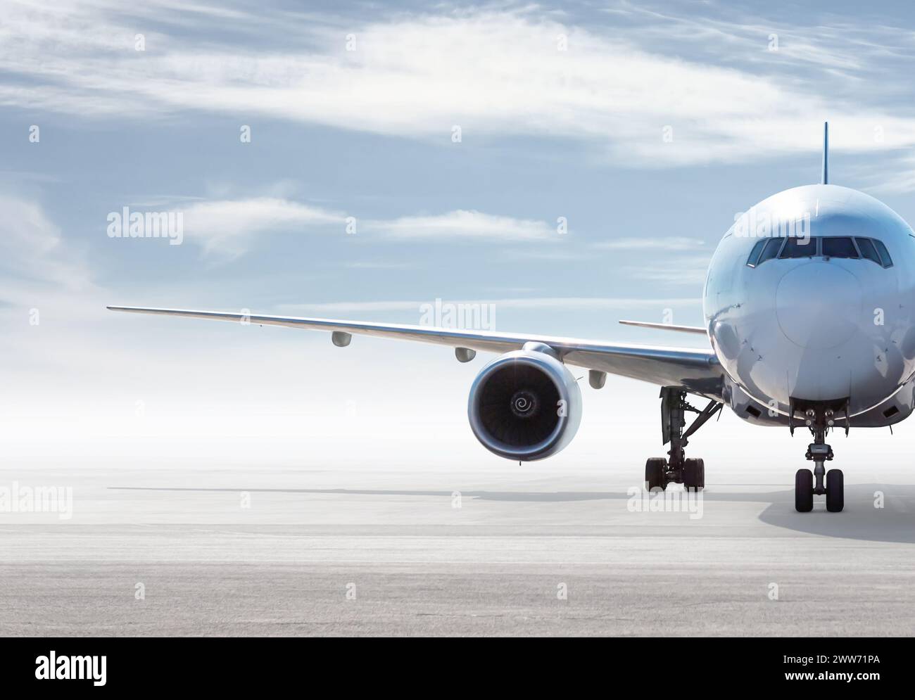 Front view of wide body passenger aircraft isolated on bright ...