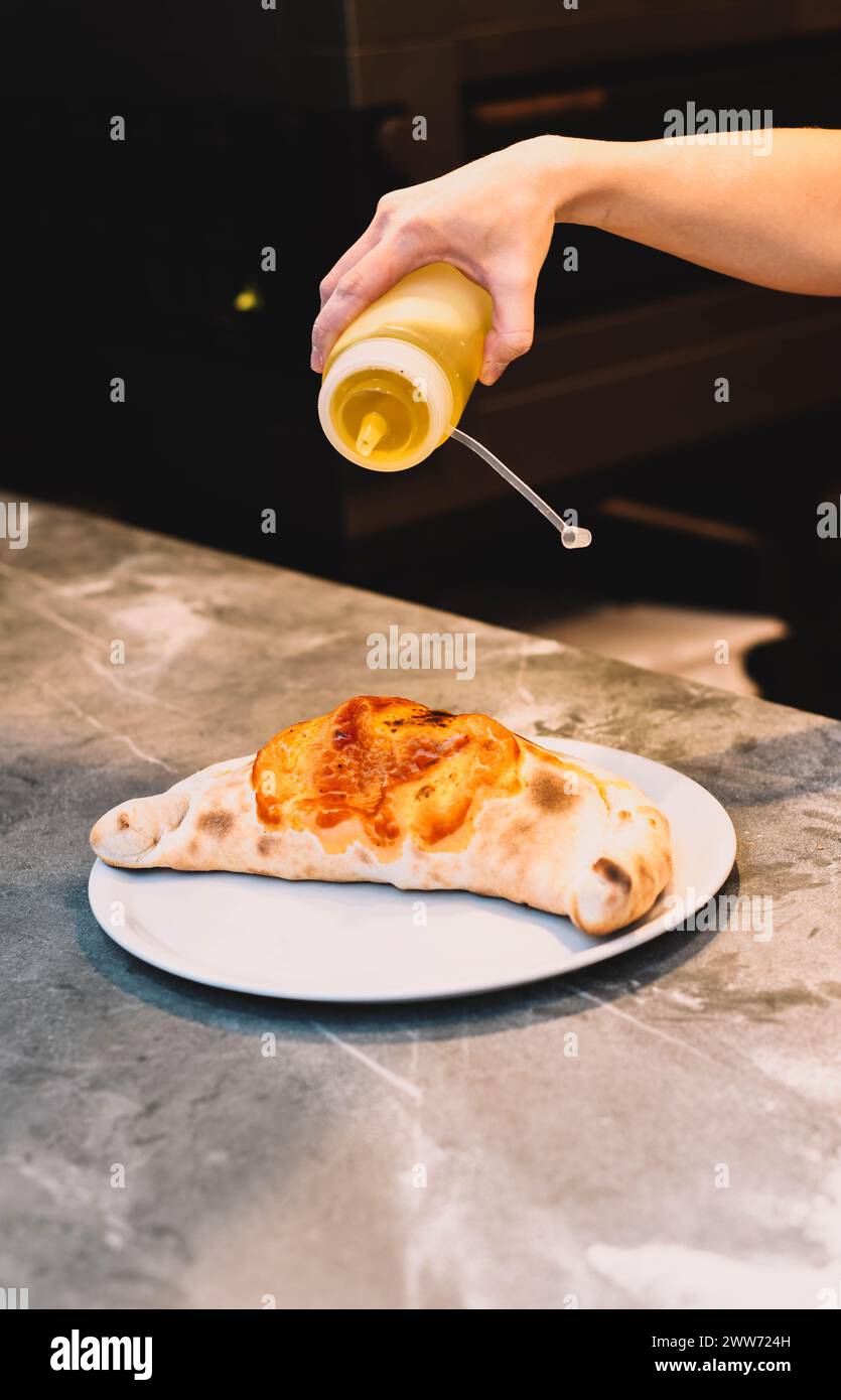 Traditional Italian calzone made with fresh dough in a wood-fired oven ...