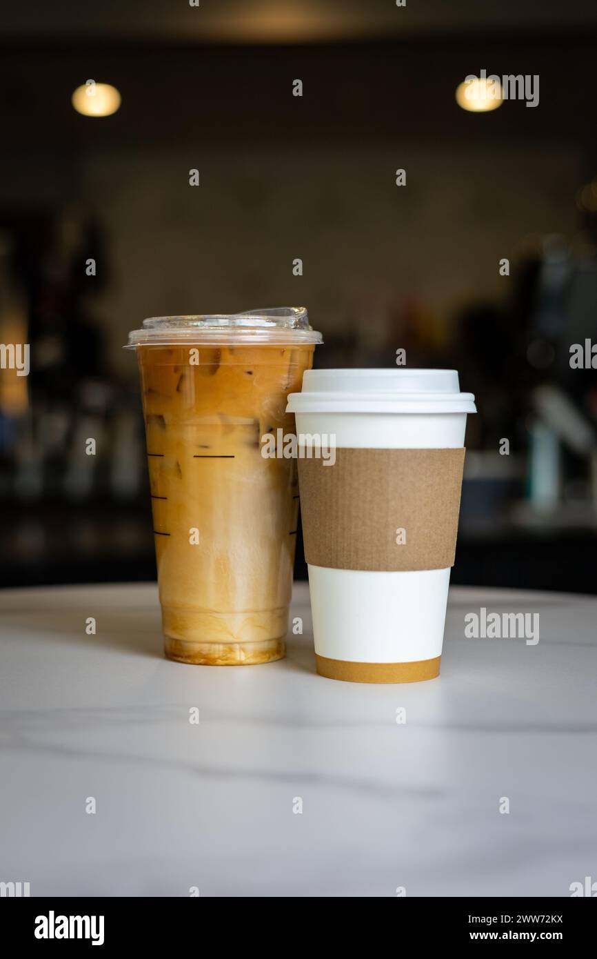 Two cups of coffee on white table, side by side Stock Photo - Alamy