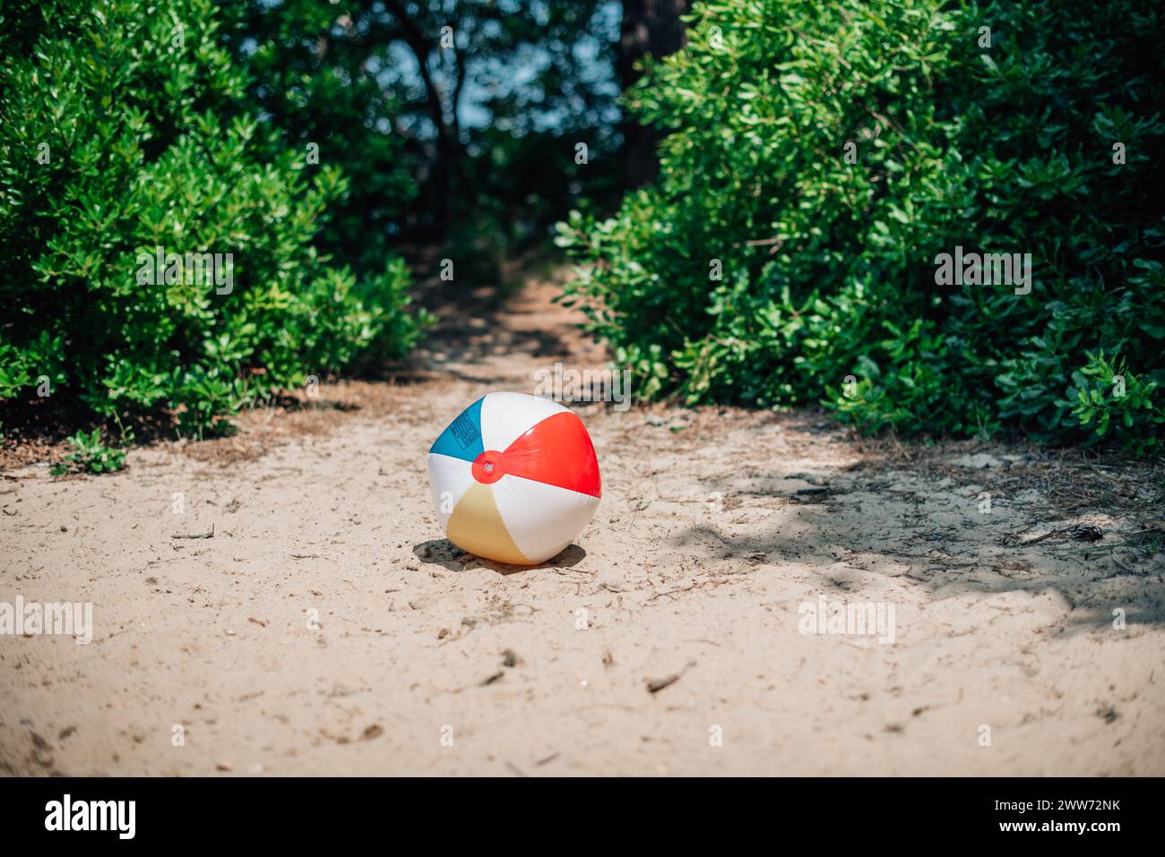 Inflatable beach ball on sand hi-res stock photography and images - Alamy