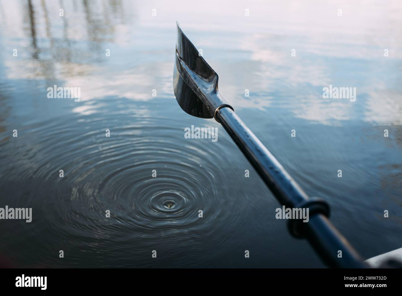 Water ripples on lake made by kayak paddle Stock Photo - Alamy