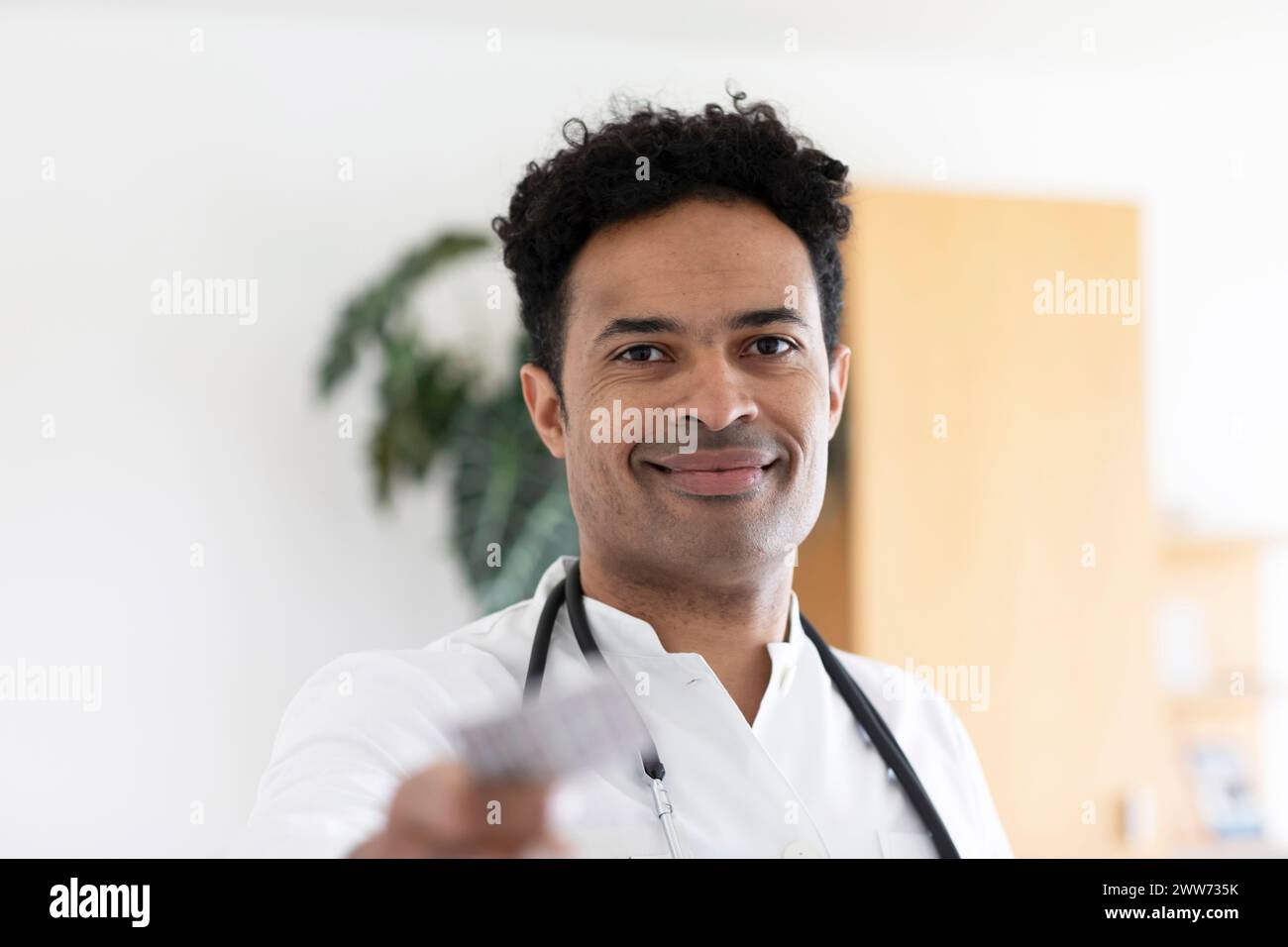 doctor, male, mixed race in a practice Stock Photo - Alamy