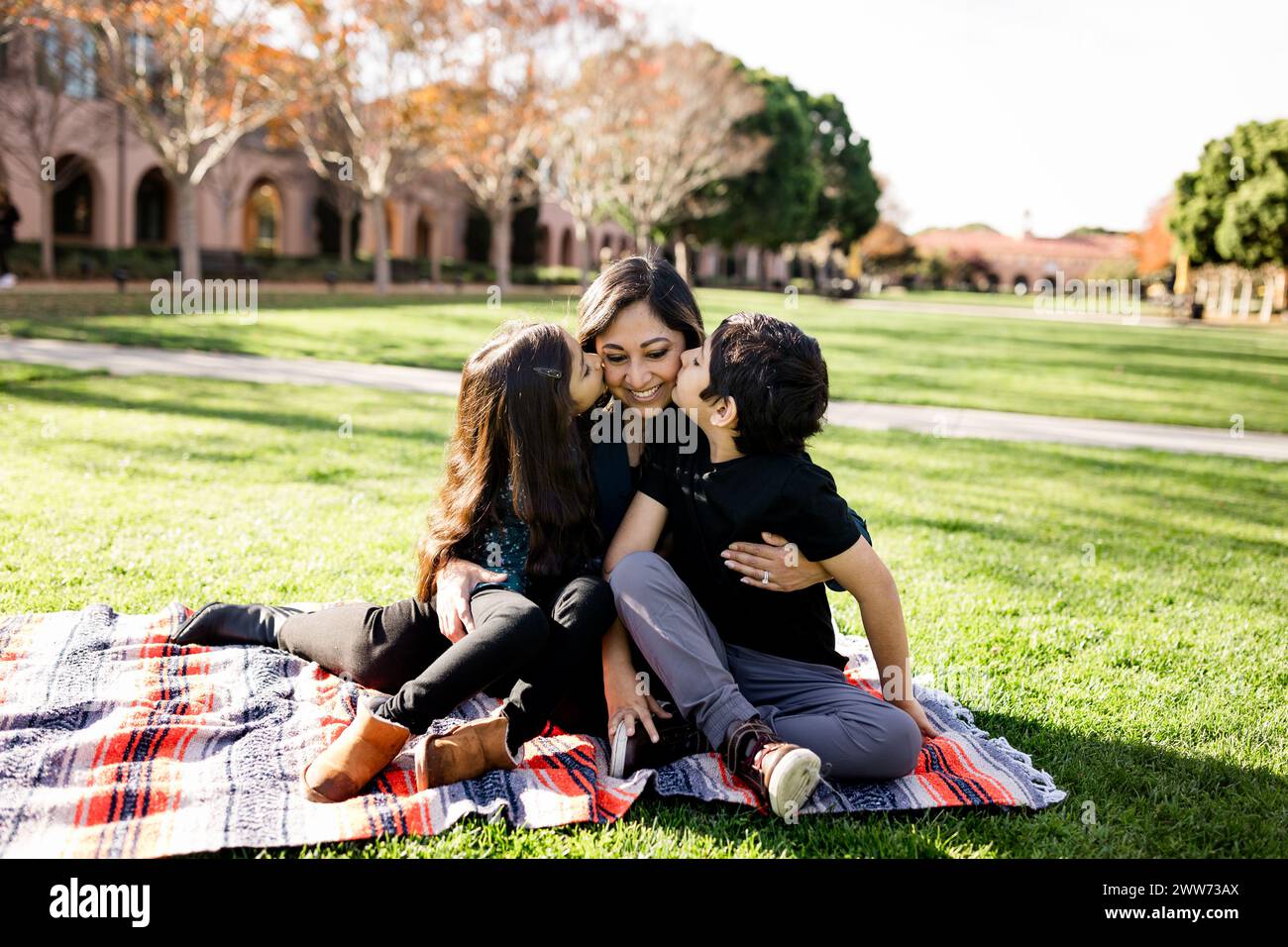 Mother of Two Sitting in Park with Daughter & Autistic Son Stock Photo ...