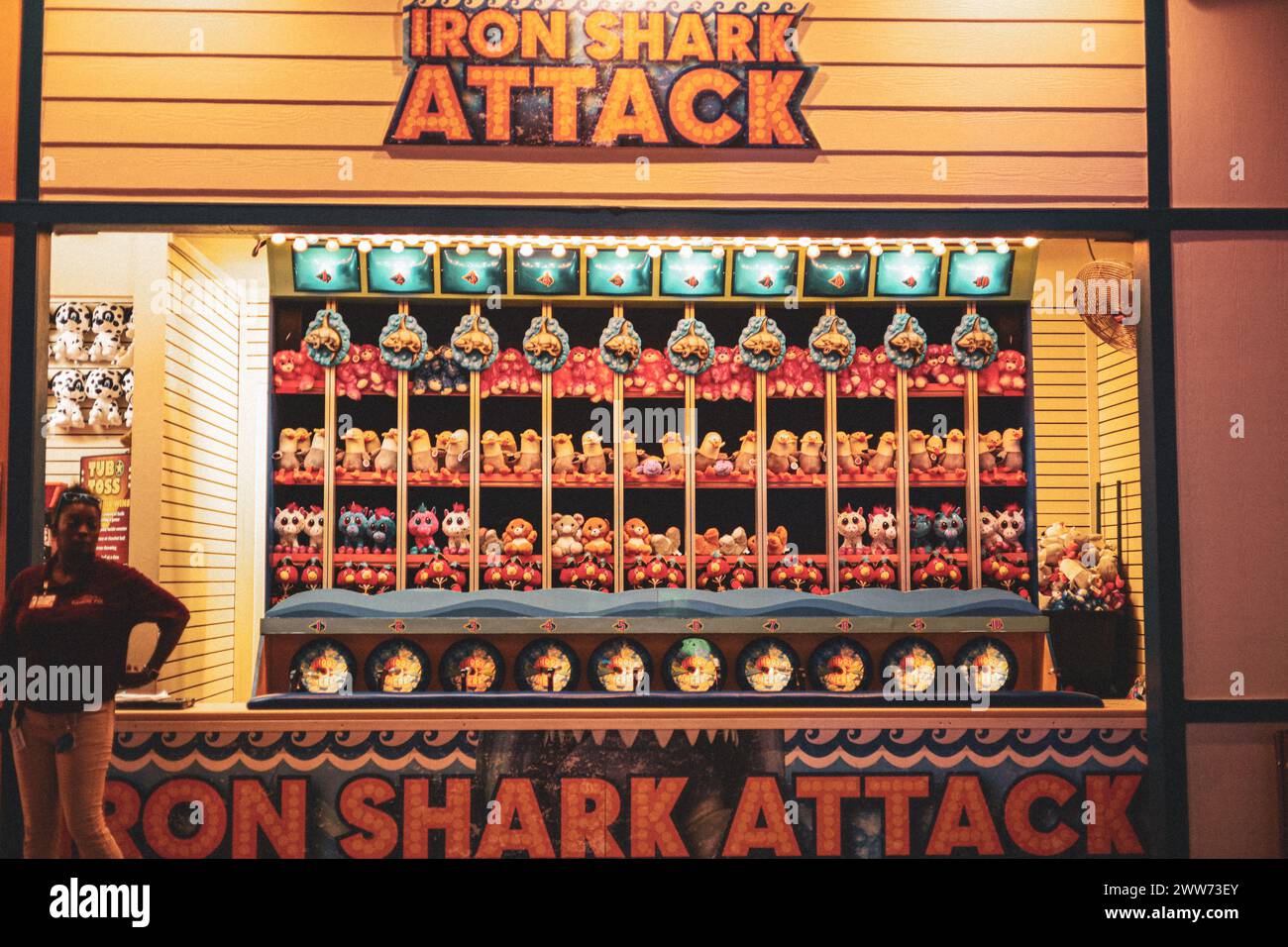 Nighttime Carnival Game Stand, Iron Shark Attack Stock Photo - Alamy